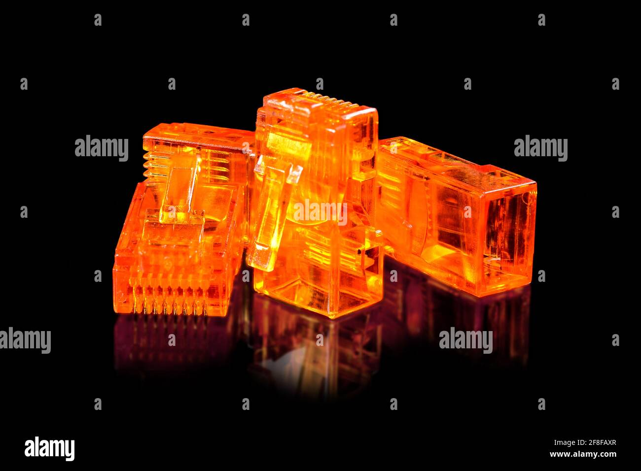Connector rj-45. Four orange transparent connectors rj45 for network ...
