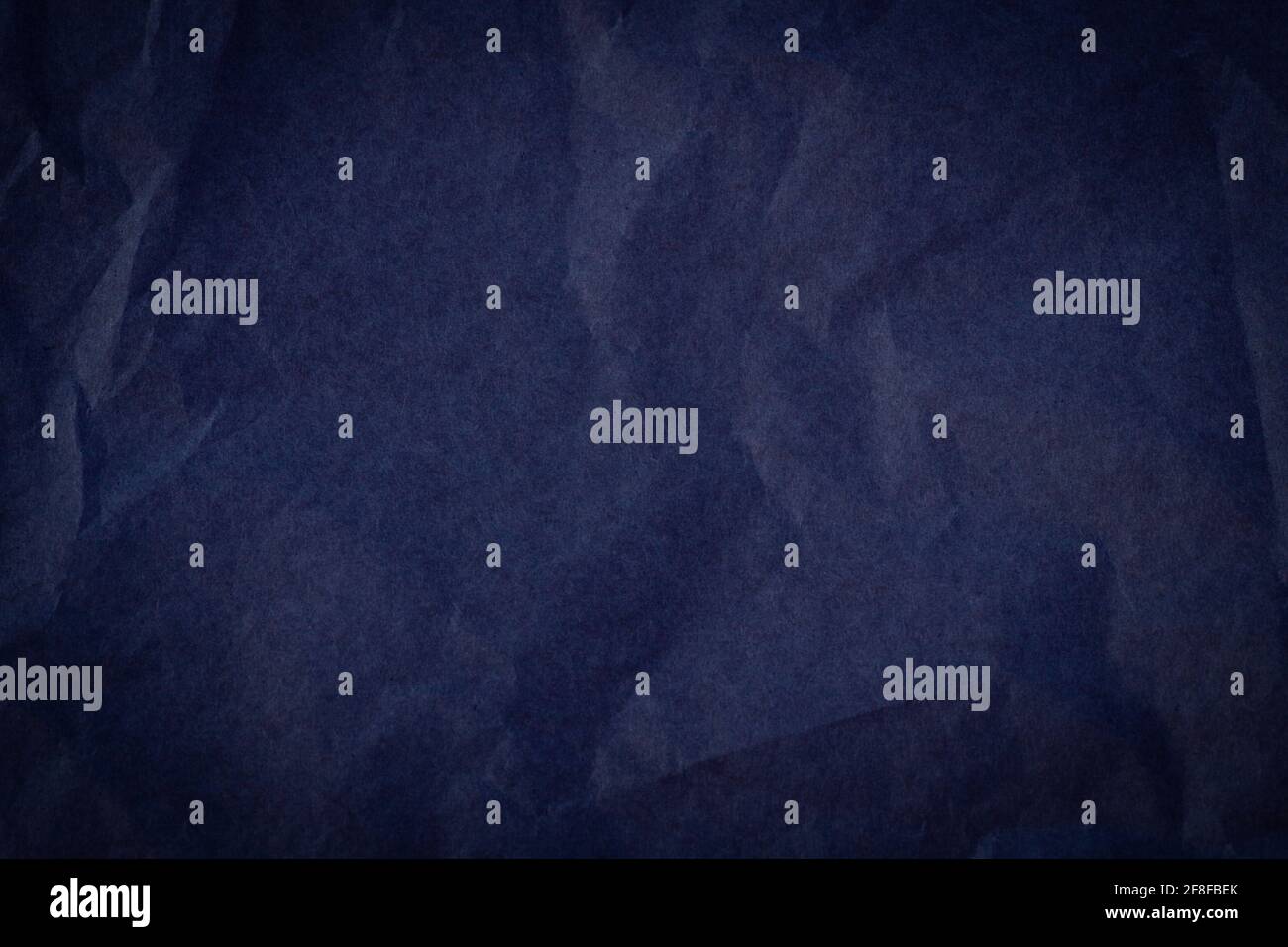 top view of empty crumpled wrinkled tissue paper dark blue color with ...