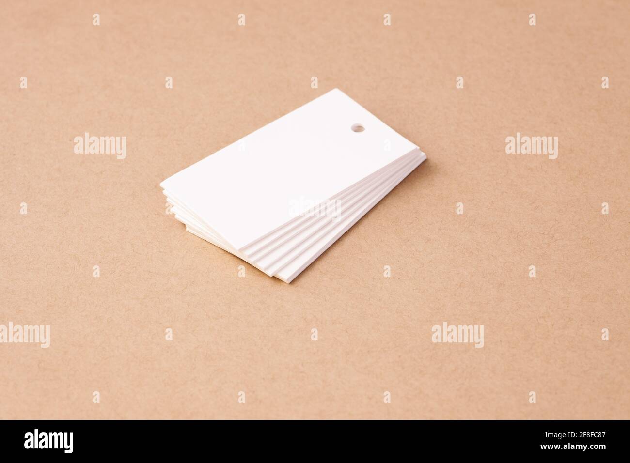 stack of white blank rectangular paper tag labels for clothing price ...