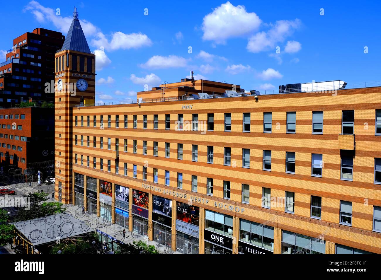 Modern beautiful buildings, skyscrapers, clock tower stand in the ...