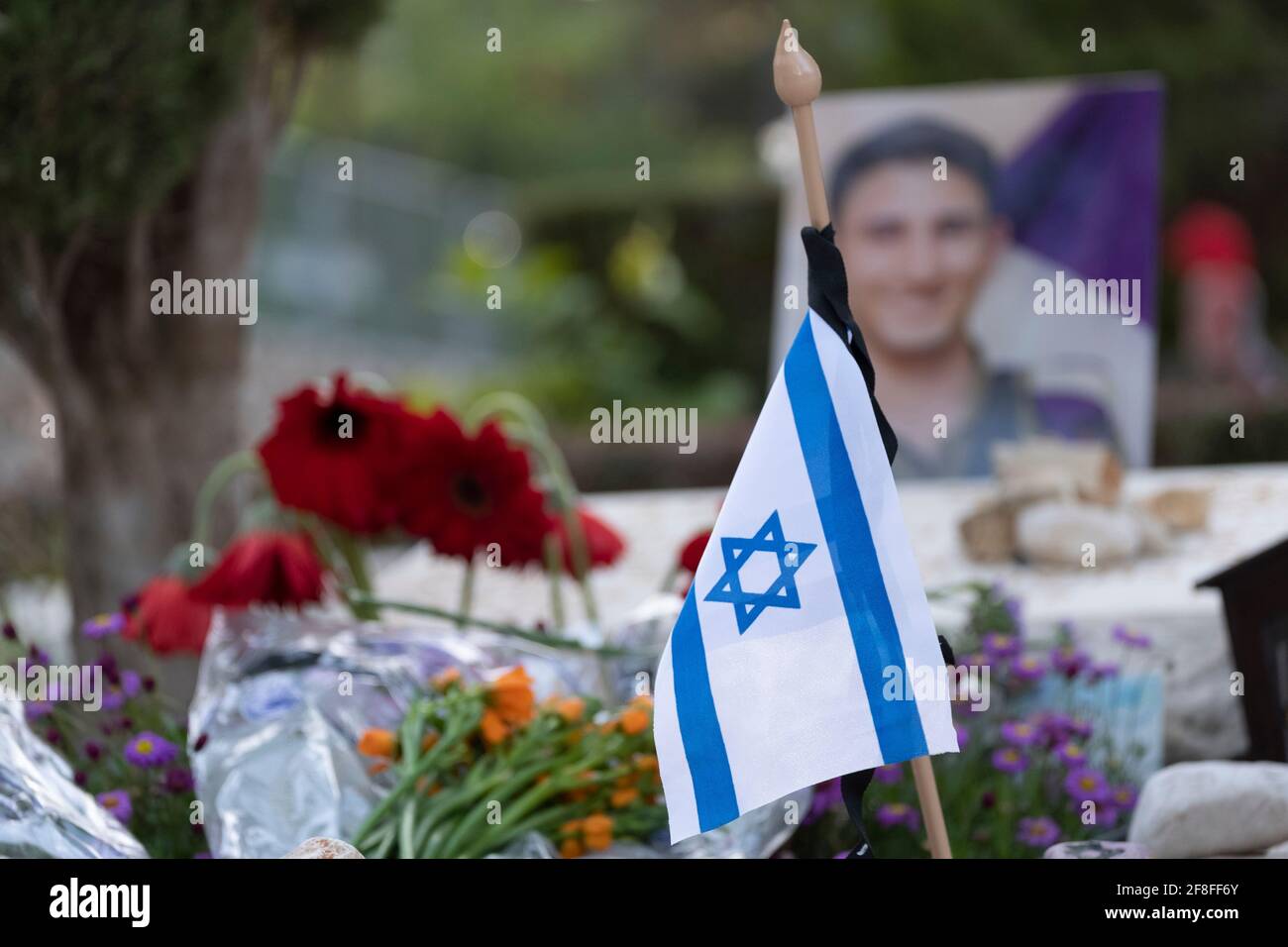 The Israeli national flag with a black mourning ribbon placed over the ...