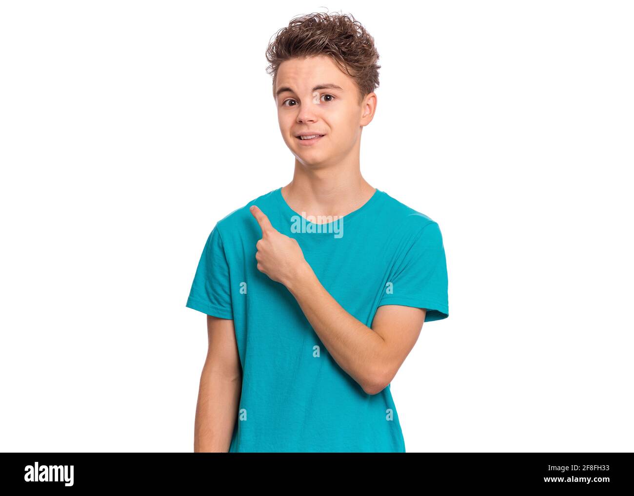 Cute teen boy pointing up, gesturing idea or doing number one gesture ...