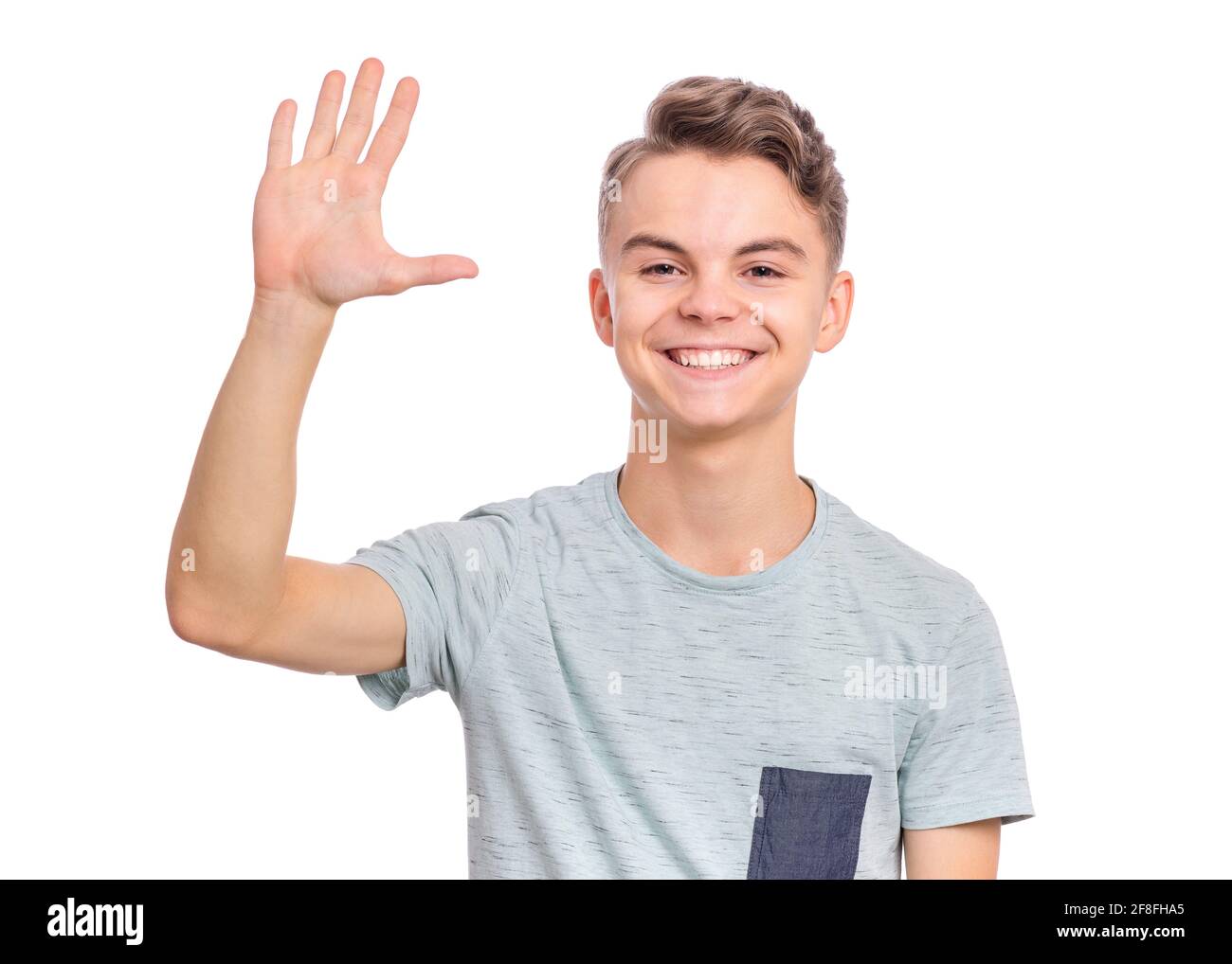 Handsome teen boy laughing looking very happy, isolated on white ...
