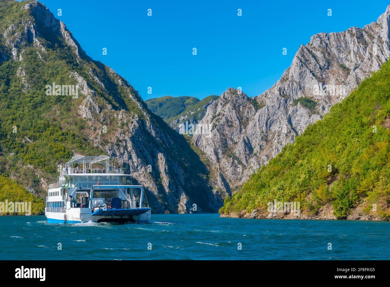 Ferry cruising lake Koman in Albania Stock Photo - Alamy