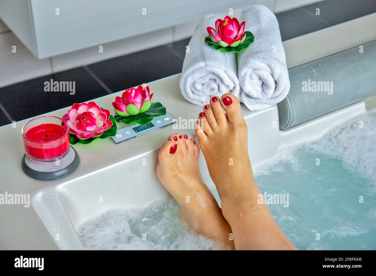 Woman wash bathtub feet hi-res stock photography and images - Alamy