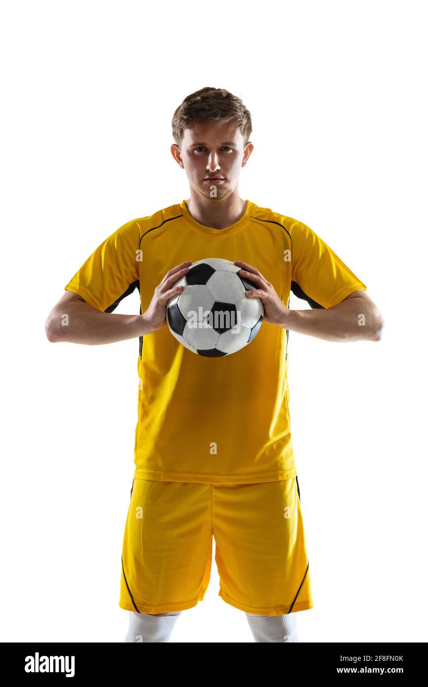 Portrait of young soccer football player posing isolated on white ...