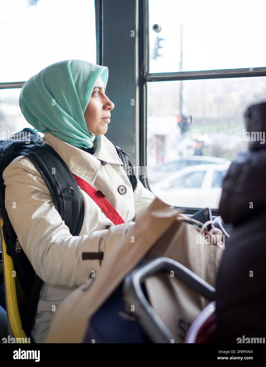 Muslim woman riding public transport in the city Stock Photo - Alamy