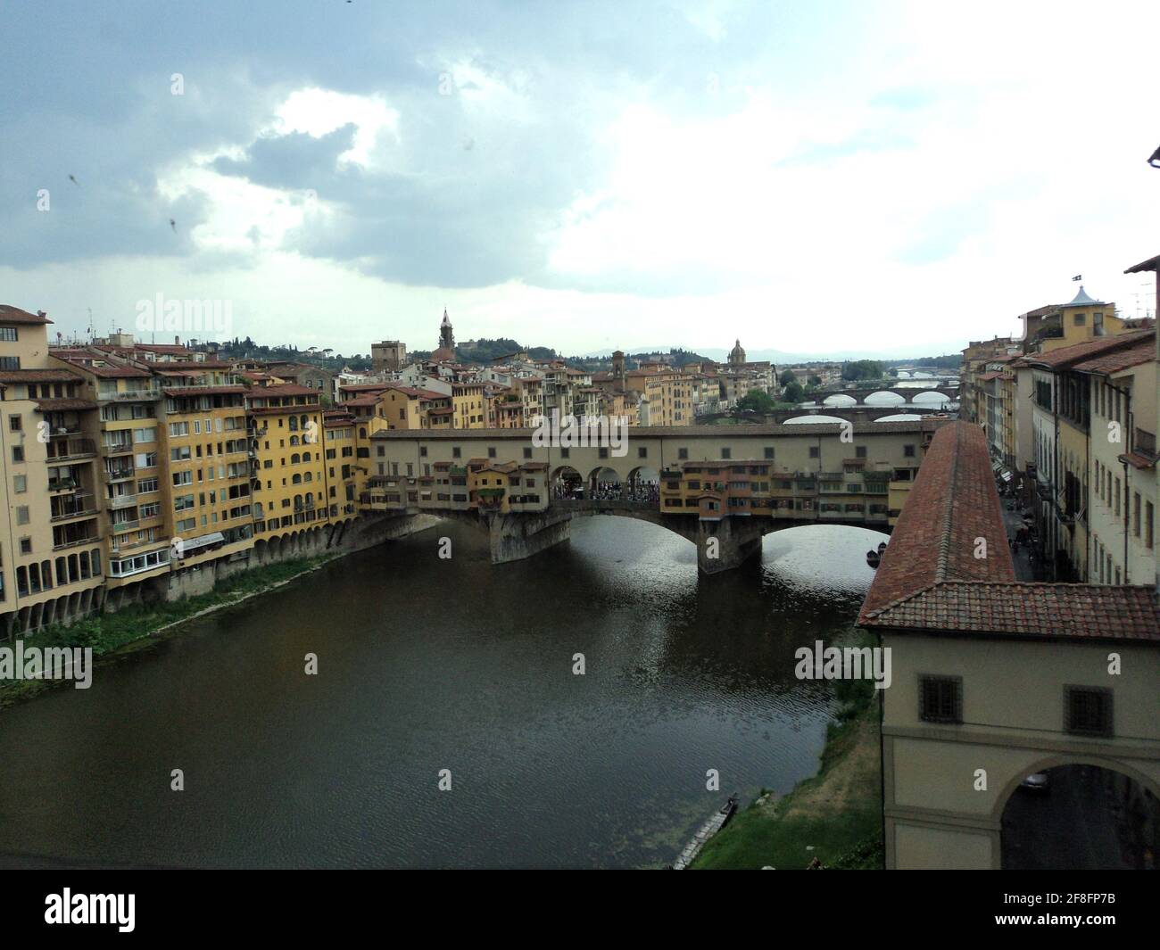 Beautiful view of The Vasari Corridor and Ponte Vecchio arch bridge in ...