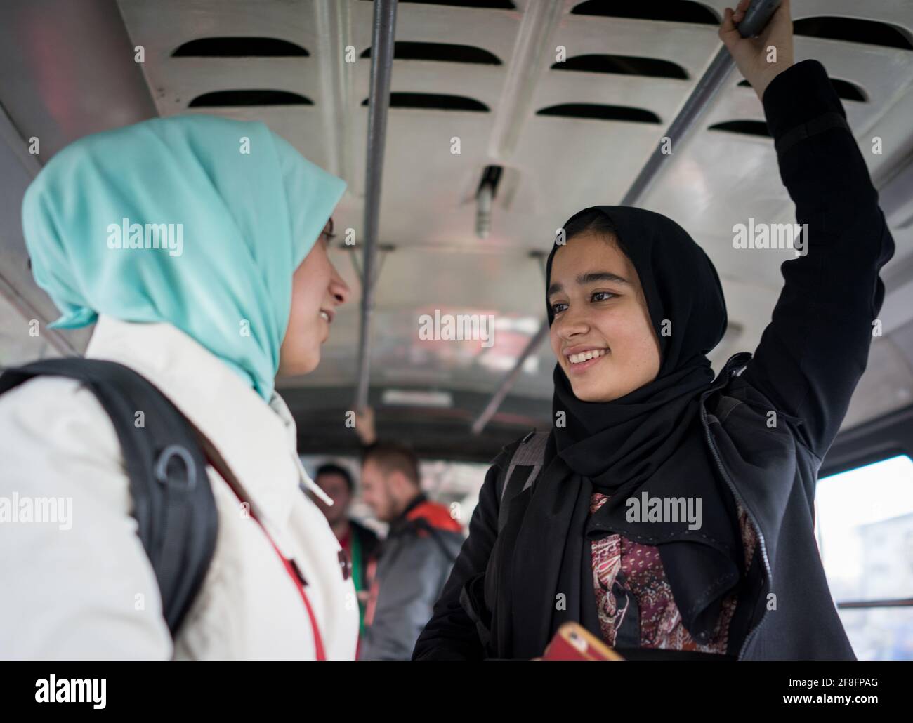 Mother and daughter riding public transport in the city Stock Photo - Alamy