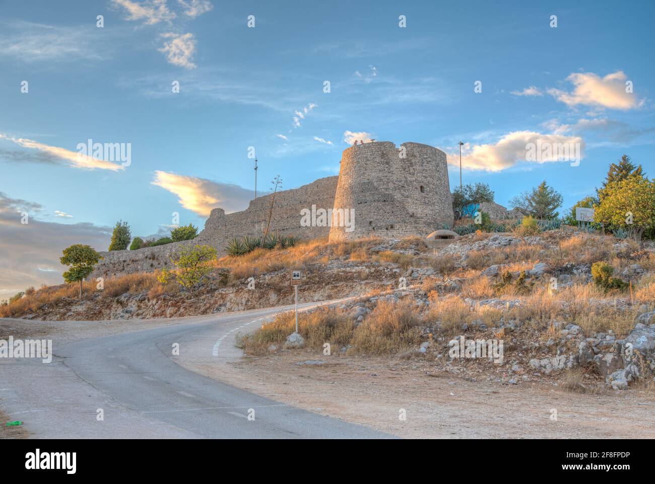 Sunset view of Lekuresi castle at Sarande, Albania Stock Photo - Alamy