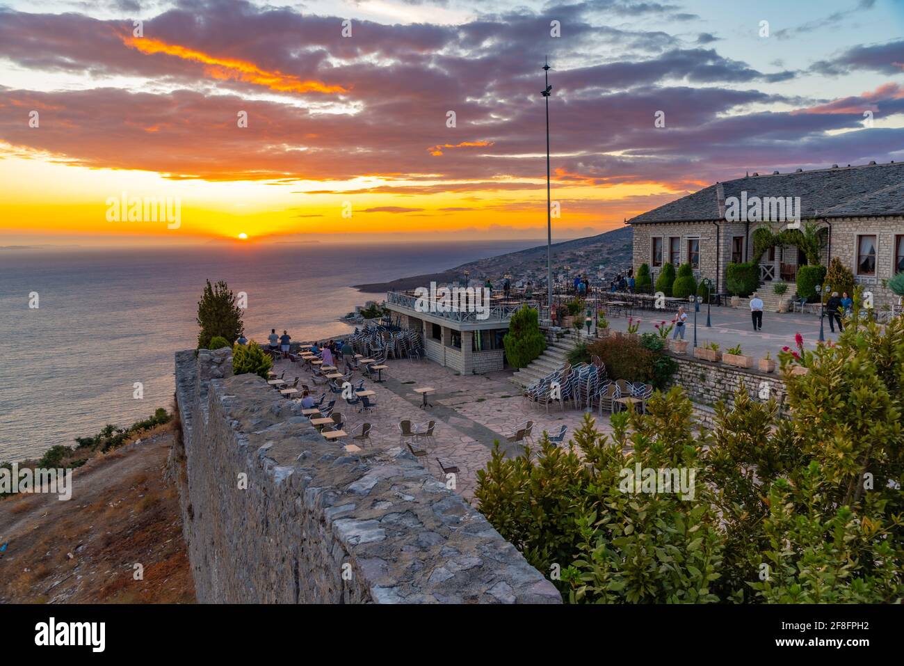 Sunset view of courtyard of Lekuresi castle at Sarande, Albania Stock ...