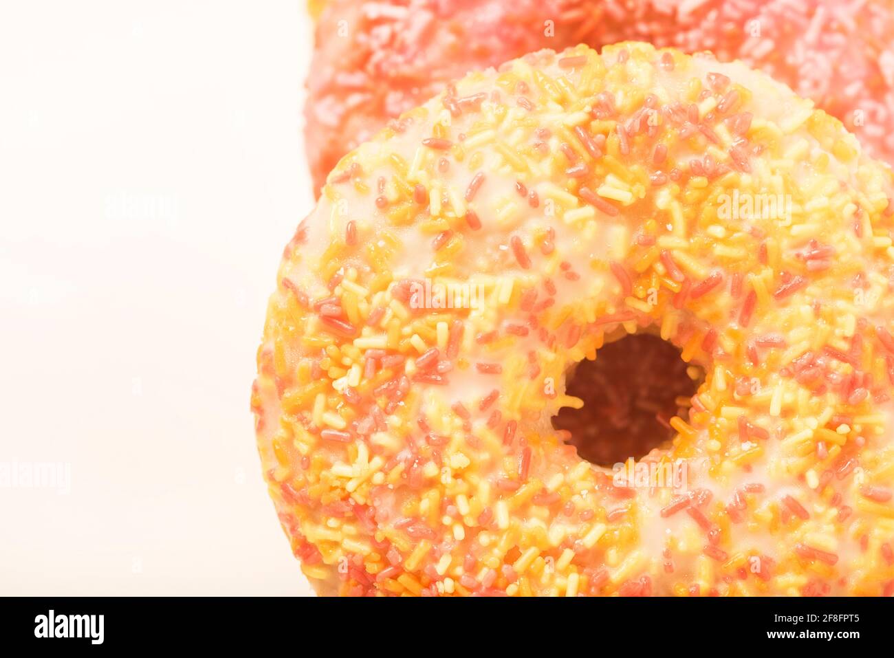 Close up of a colourful iced ring doughnut with sprinkles Stock Photo ...