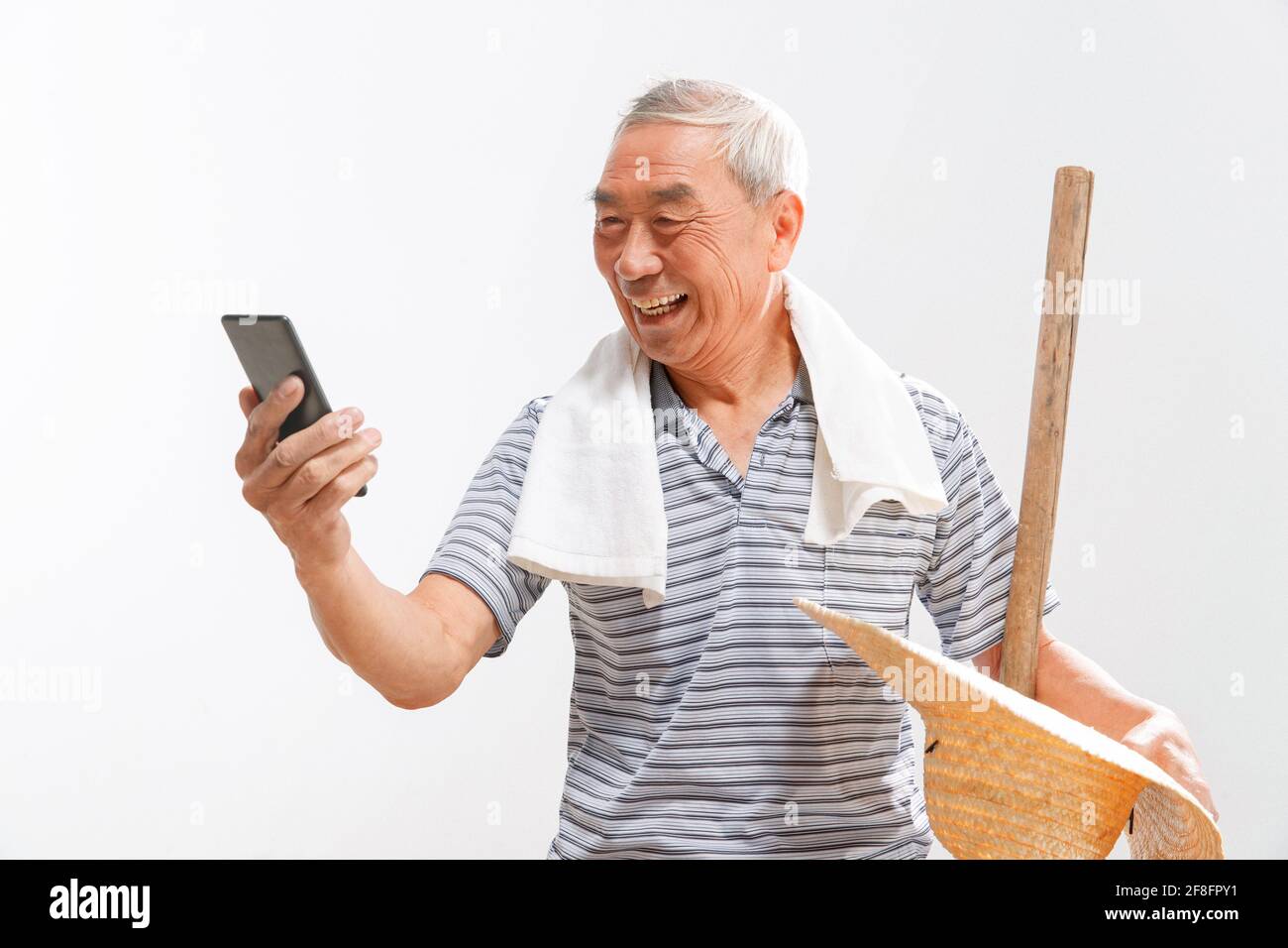 Farmers with mobile phone Stock Photo - Alamy