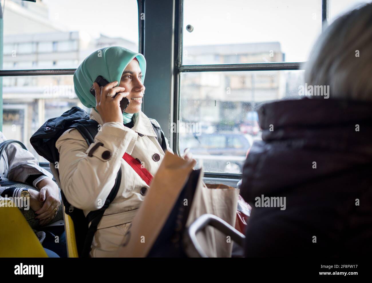 Muslim woman riding public transport in the city Stock Photo - Alamy