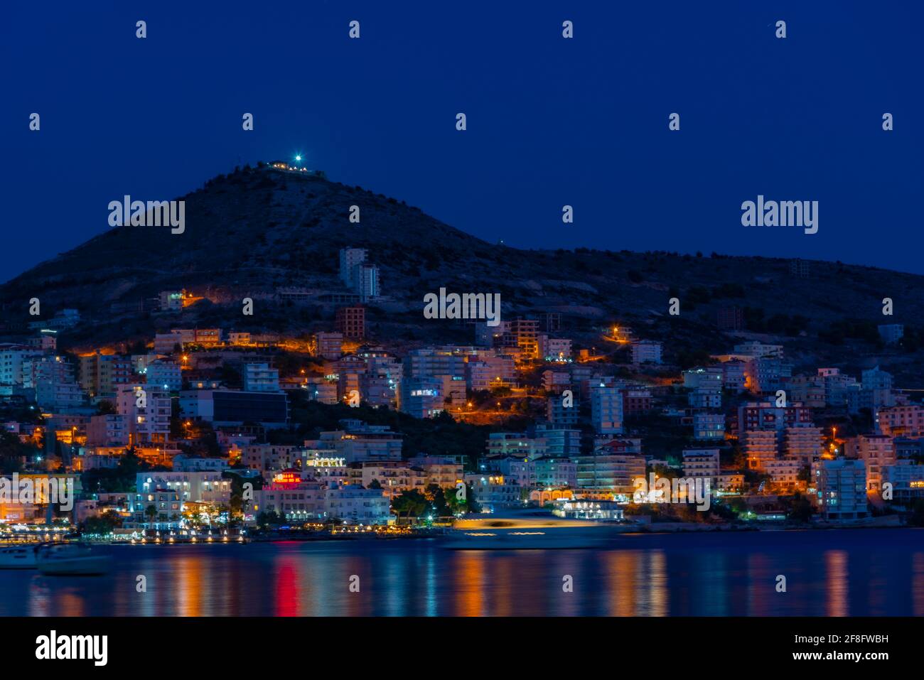 Sunset view of seaside of Sarande with Lekuresi castle, Albania Stock ...