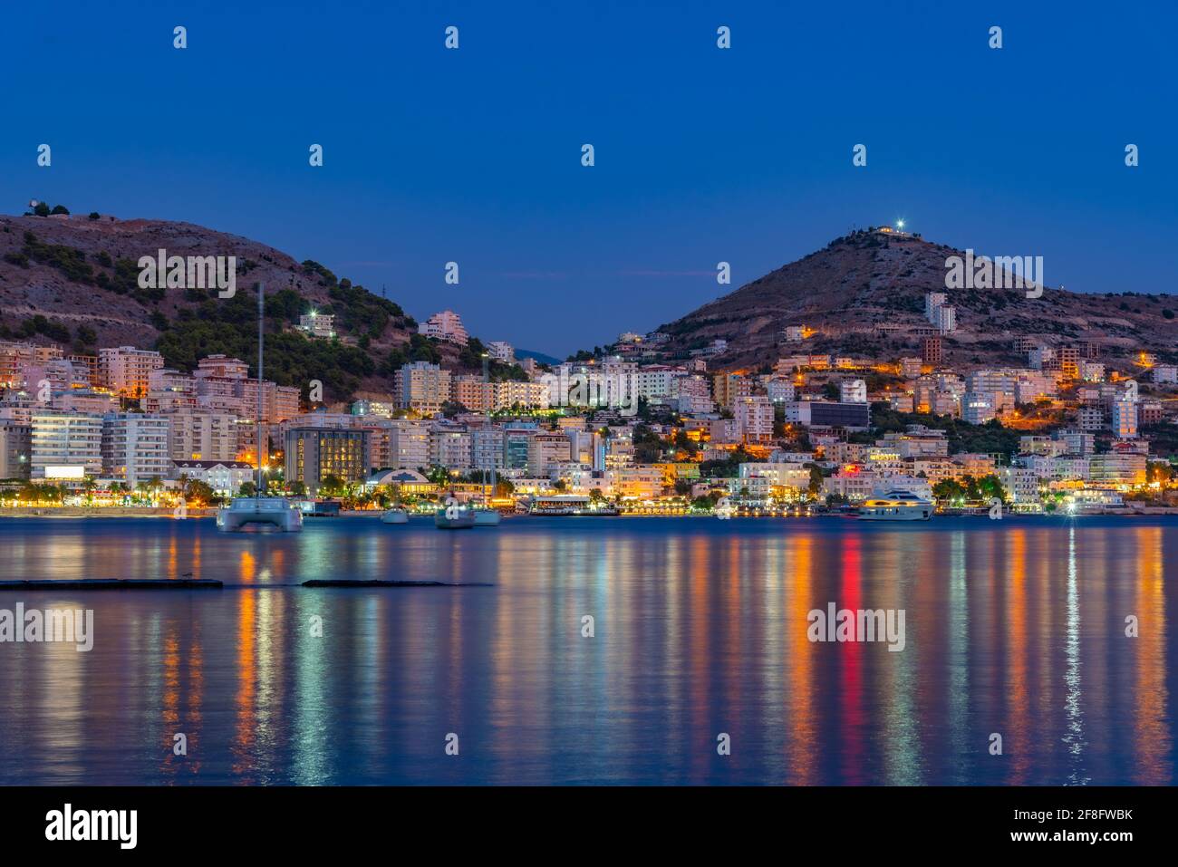 Sunset view of seaside of Sarande with Lekuresi castle, Albania Stock ...