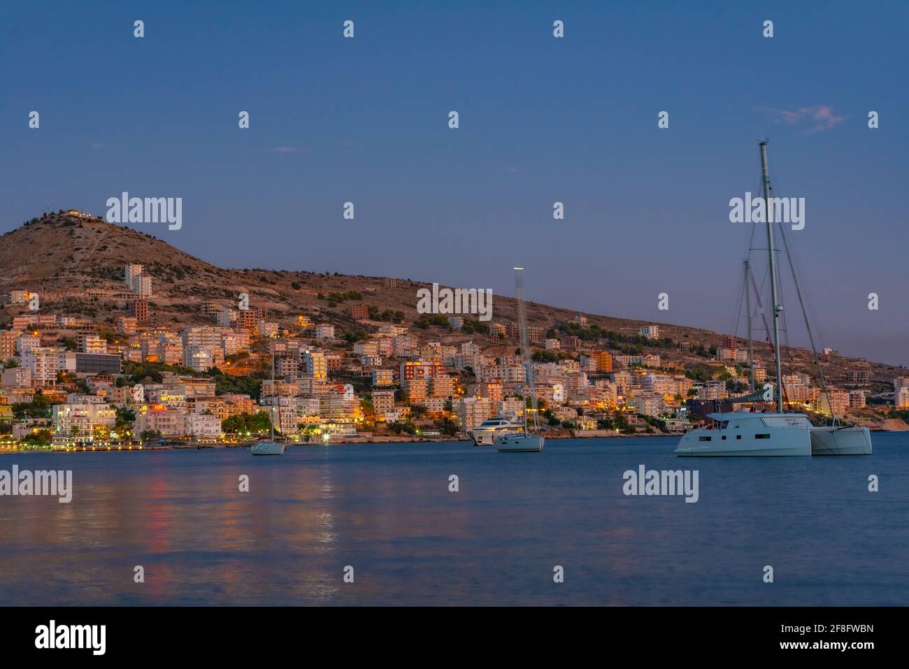 Sunset view of seaside of Sarande with Lekuresi castle, Albania Stock ...