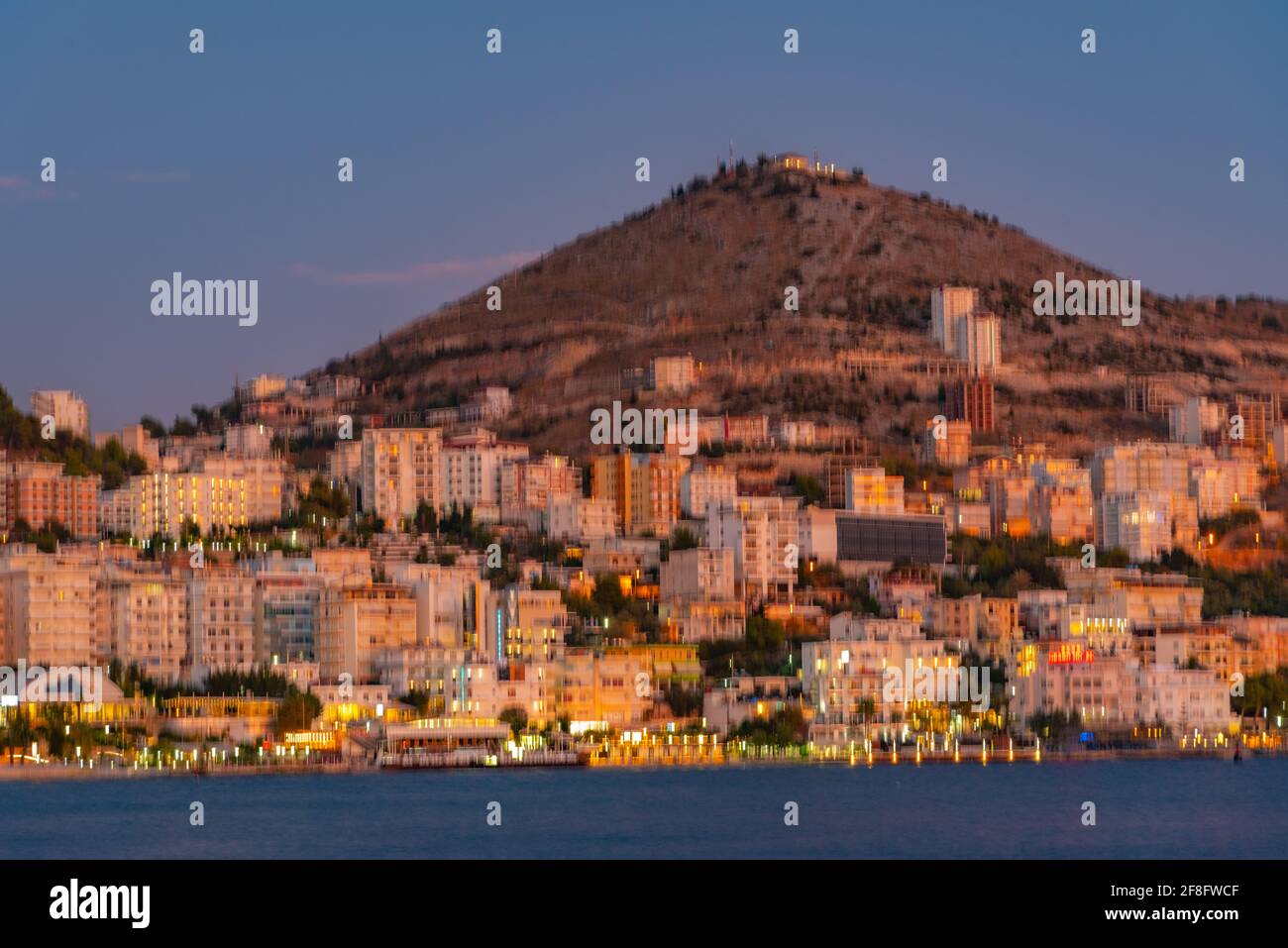 Sunset view of seaside of Sarande with Lekuresi castle, Albania Stock ...