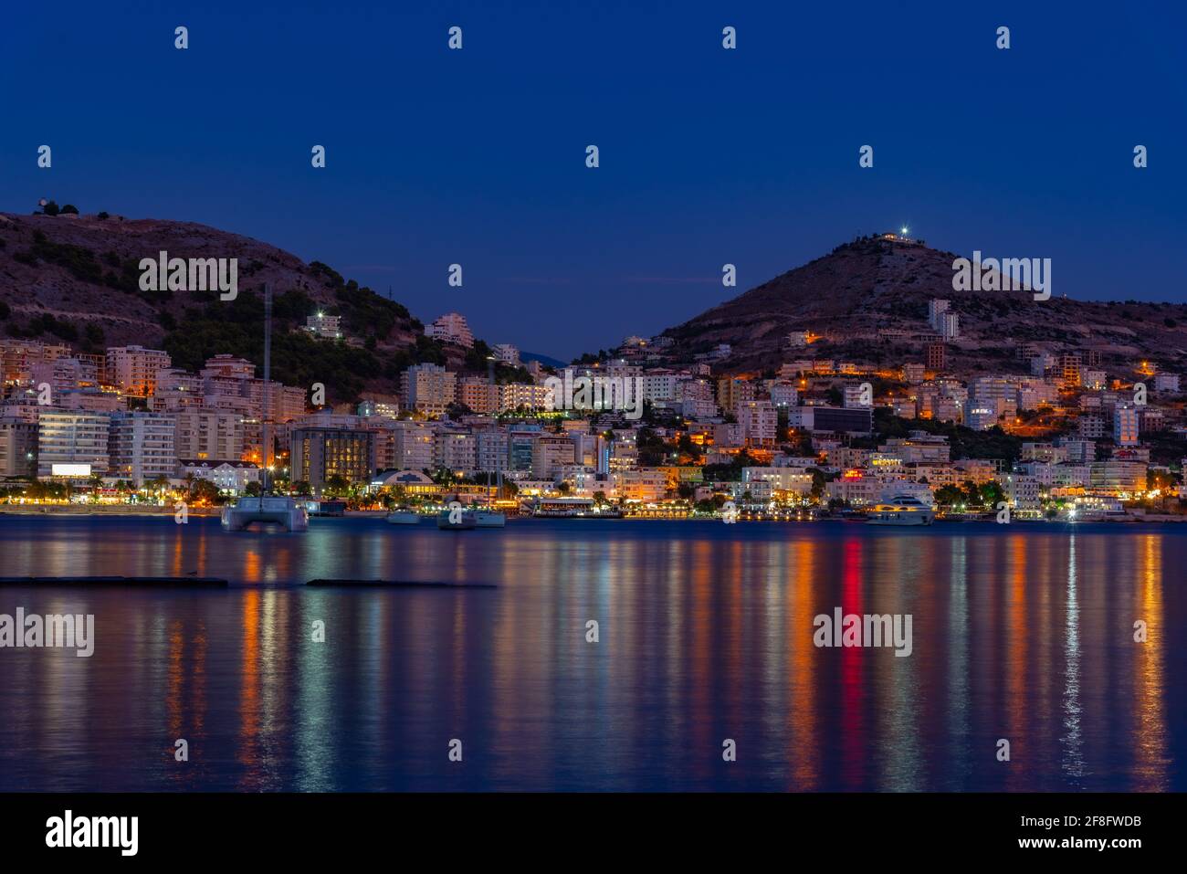 Sunset view of seaside of Sarande with Lekuresi castle, Albania Stock ...