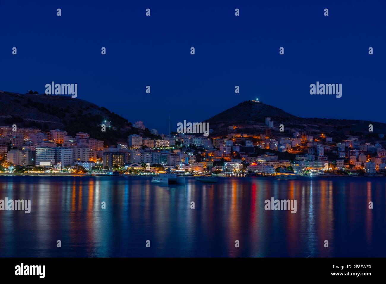 Sunset view of seaside of Sarande with Lekuresi castle, Albania Stock ...