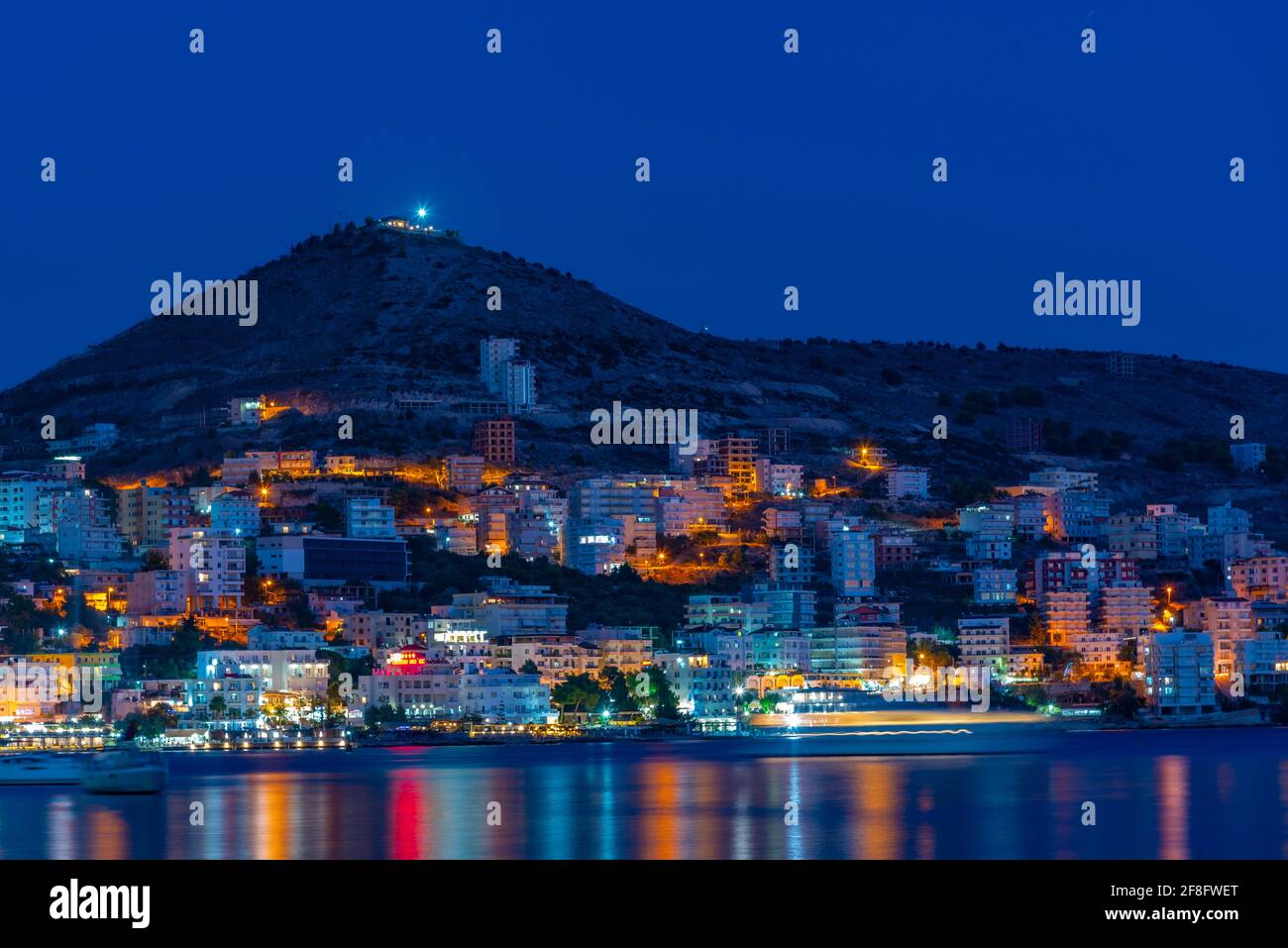 Sunset view of seaside of Sarande with Lekuresi castle, Albania Stock ...