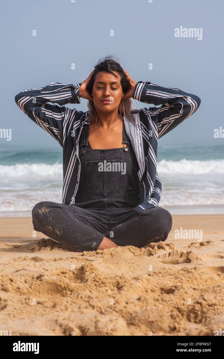 Woman having a moment at the beach Stock Photo - Alamy