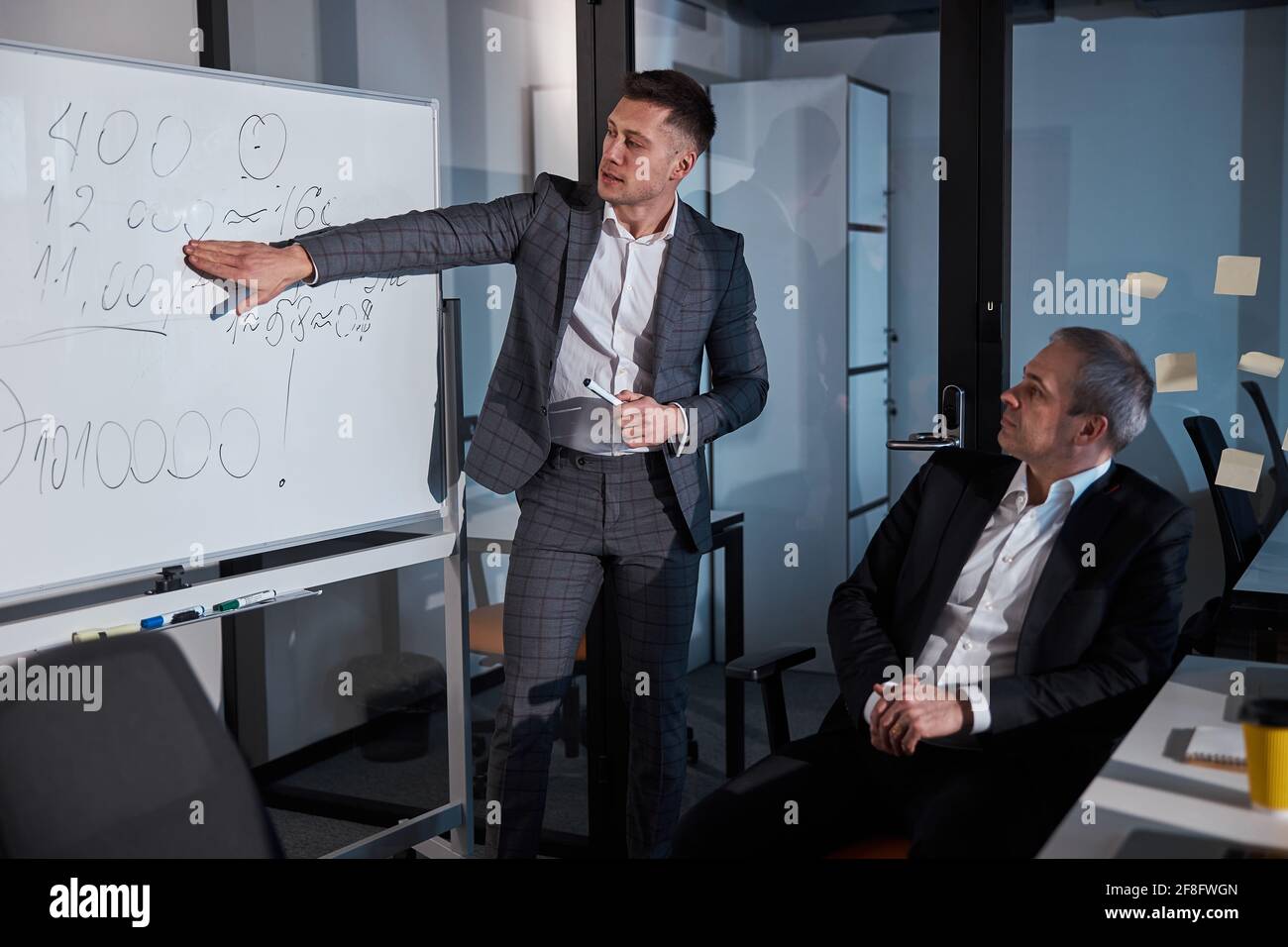 Business colleagues discussing project in modern office Stock Photo - Alamy