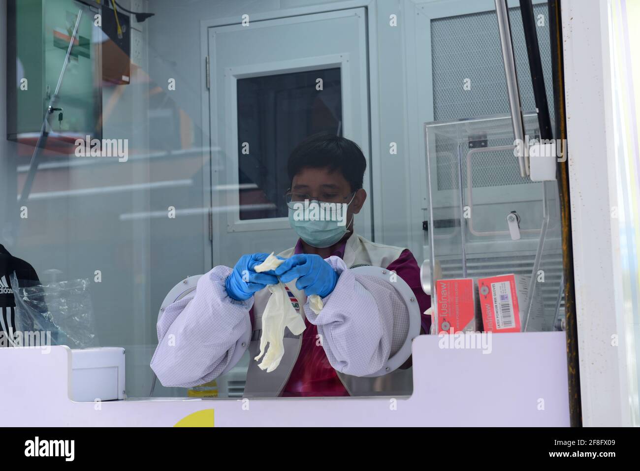 Bangkok, Thailand. 14th Apr, 2021. Health officers using mobile vehicle ...