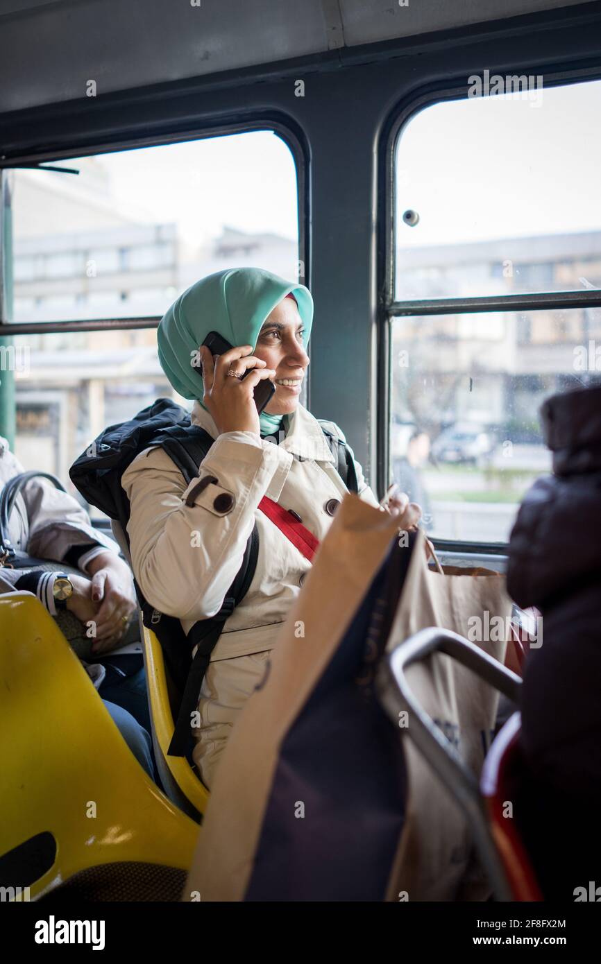 Muslim woman riding public transport in the city Stock Photo - Alamy