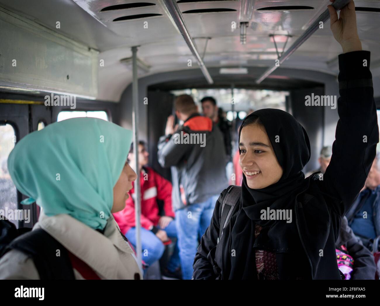 Mother and daughter riding public transport in the city Stock Photo - Alamy