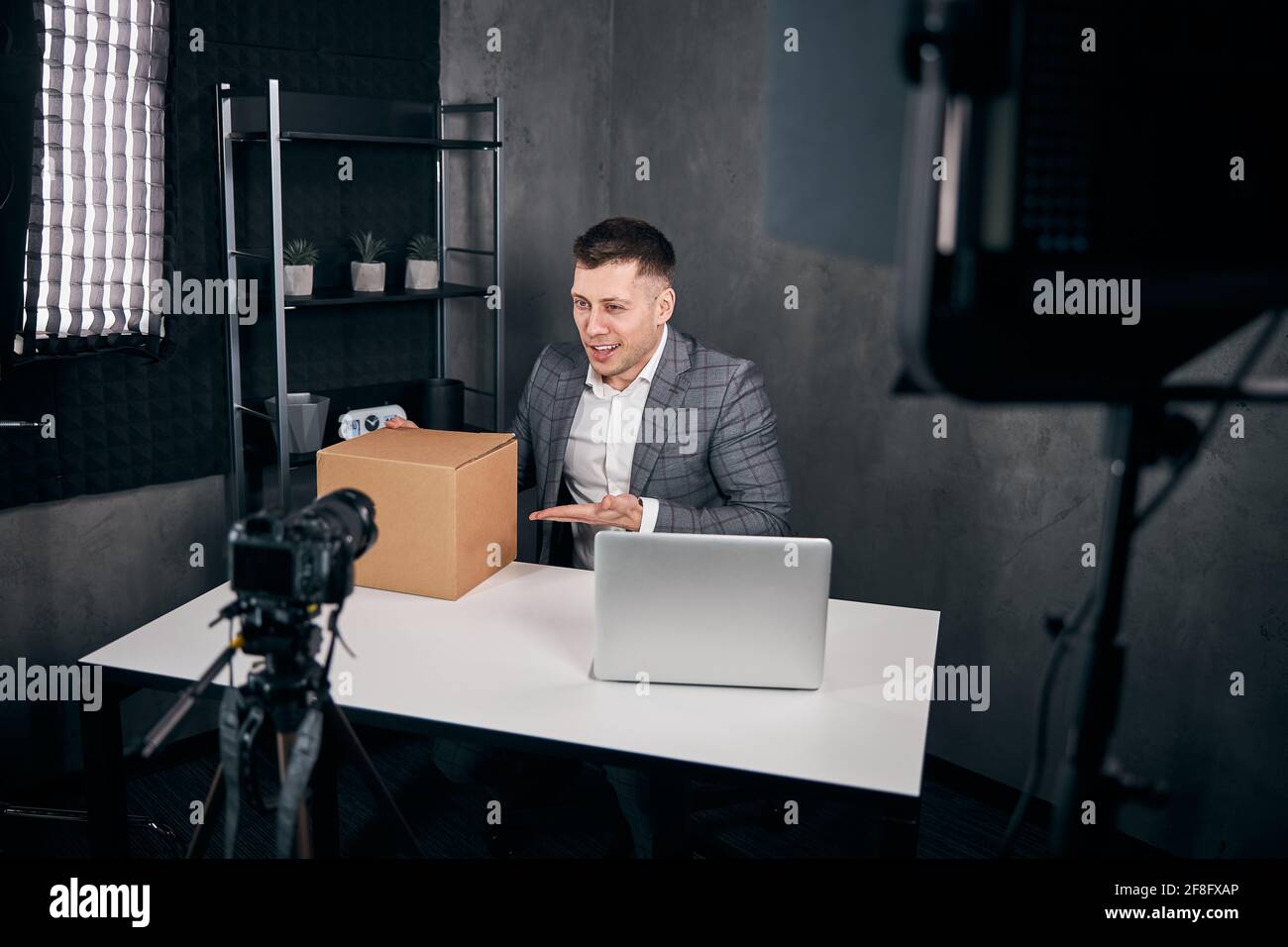 Cheerful young man recording video for blog Stock Photo - Alamy