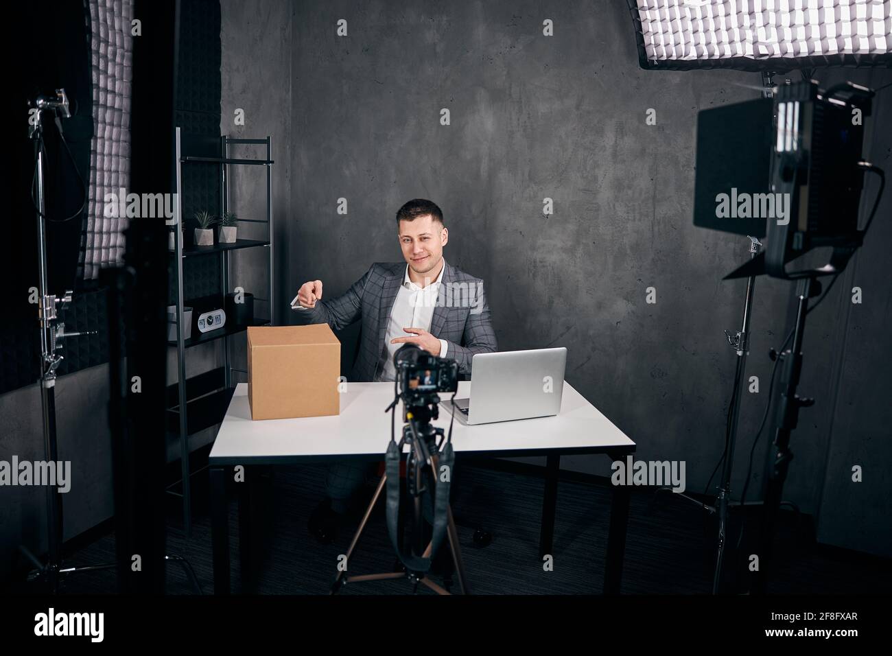 Handsome young man recording video in studio Stock Photo - Alamy