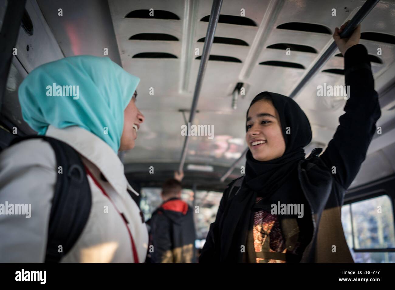 Mother and daughter riding public transport in the city Stock Photo - Alamy