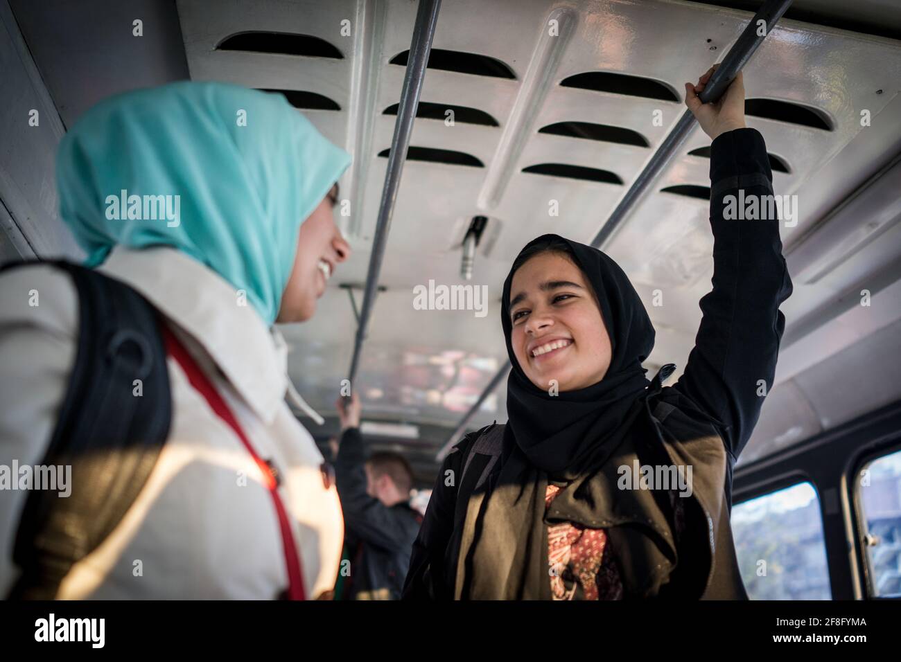 Mother and daughter riding public transport in the city Stock Photo - Alamy