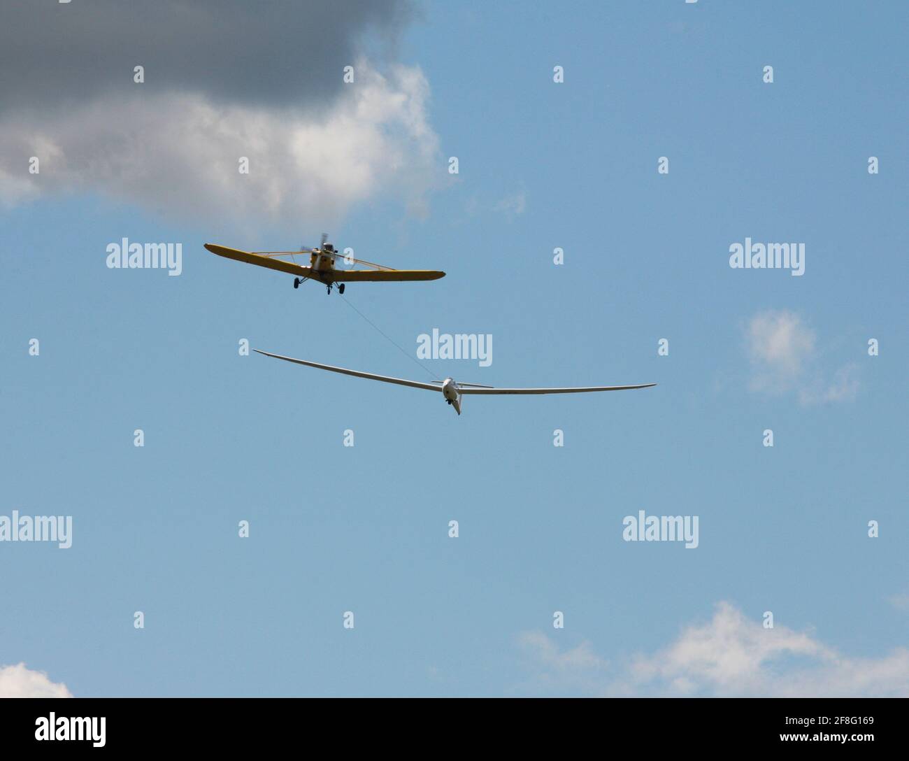 GLIDER aerotowing up by aeroplane Stock Photo - Alamy