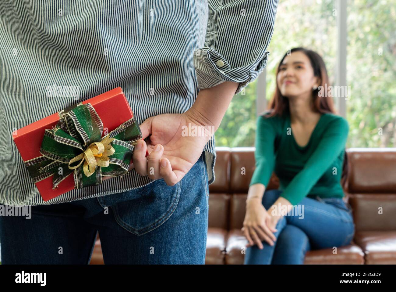 Happy couple giving gift present to celebrate anniversary. Marriage ...