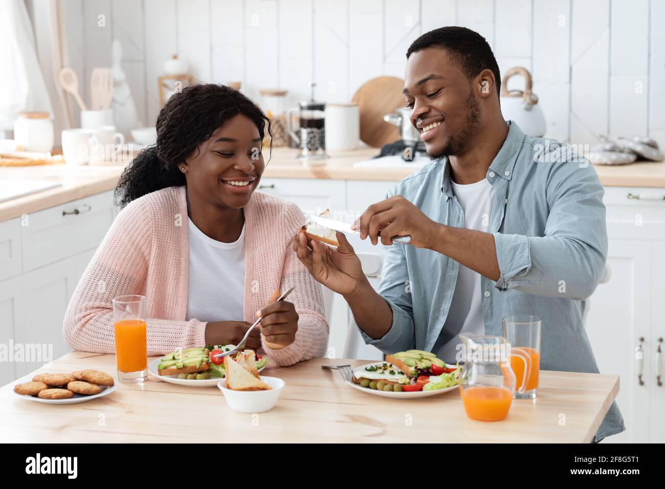 Woman eating breakfast toast hi-res stock photography and images - Alamy
