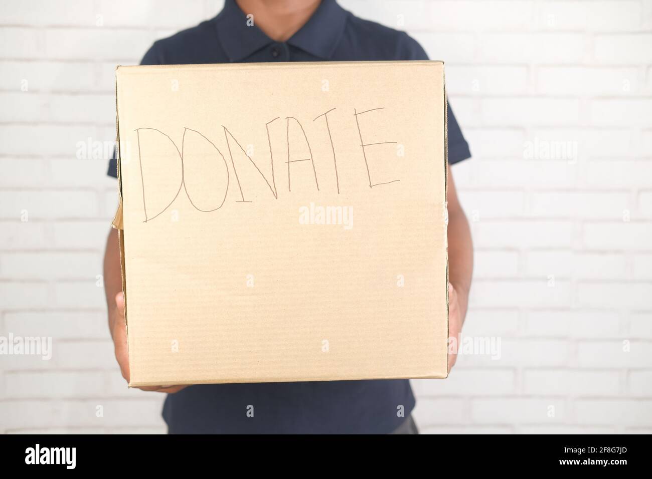 Delivery man holding box hi-res stock photography and images - Alamy