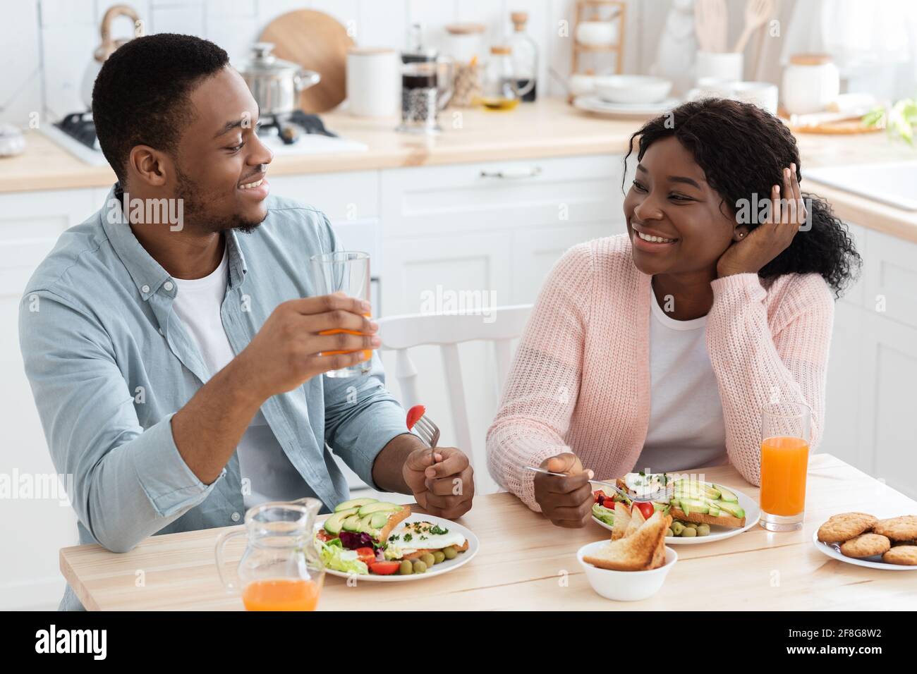 Family enjoying breakfast talking hi-res stock photography and images ...