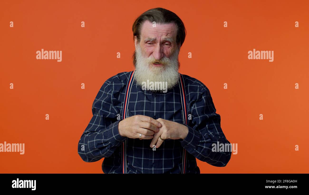 Upset disappointed senior old man wipes tears and cries from despair ...