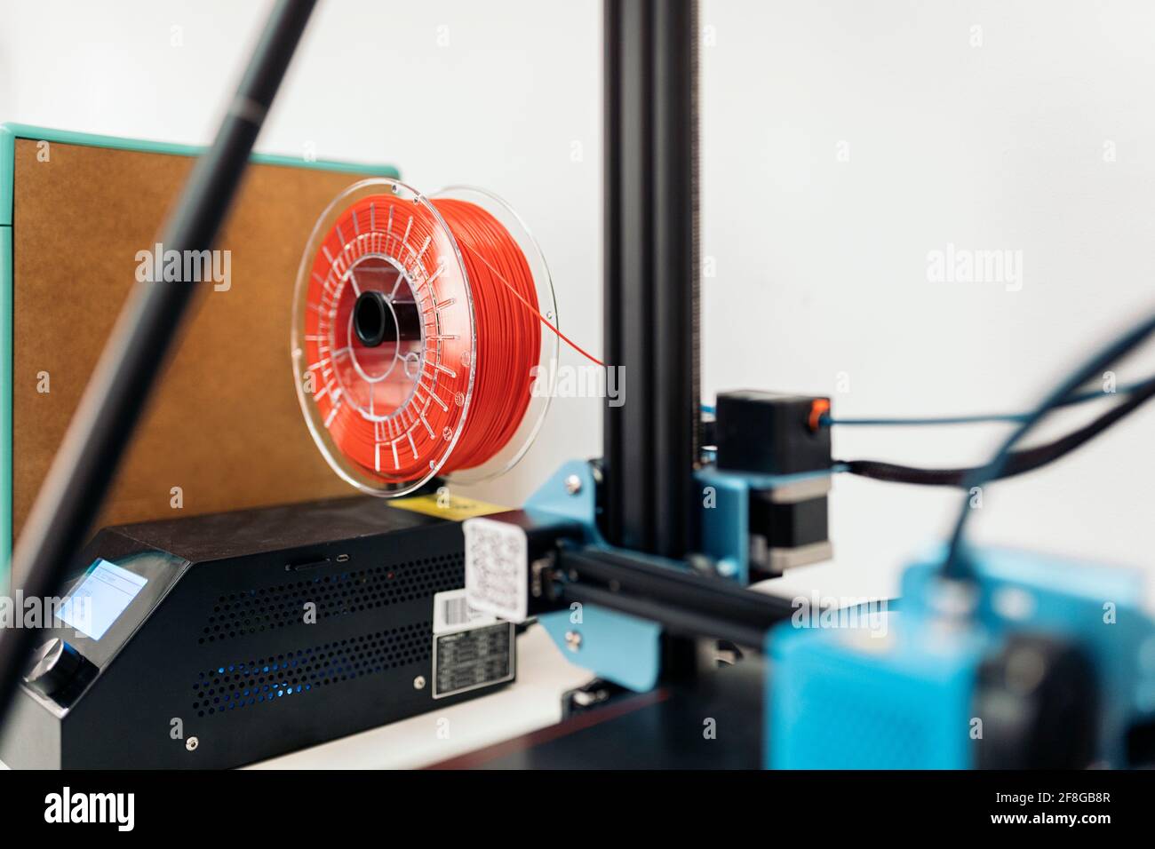 Stock photo of modern 3d printer’s parts with blue and red cable Stock ...