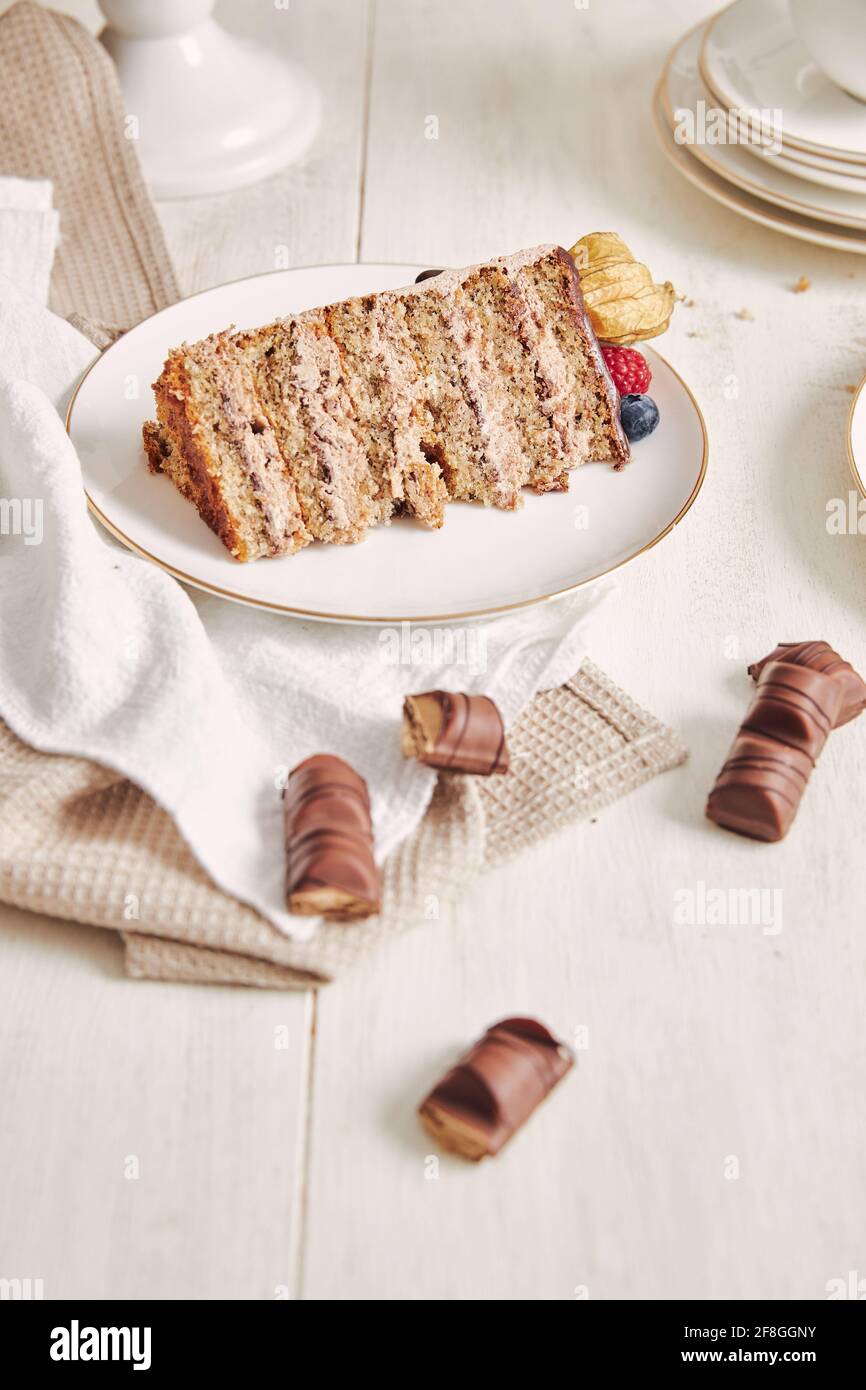 Vertical high angle shot of a slice of chocolate and berry cake on a ...