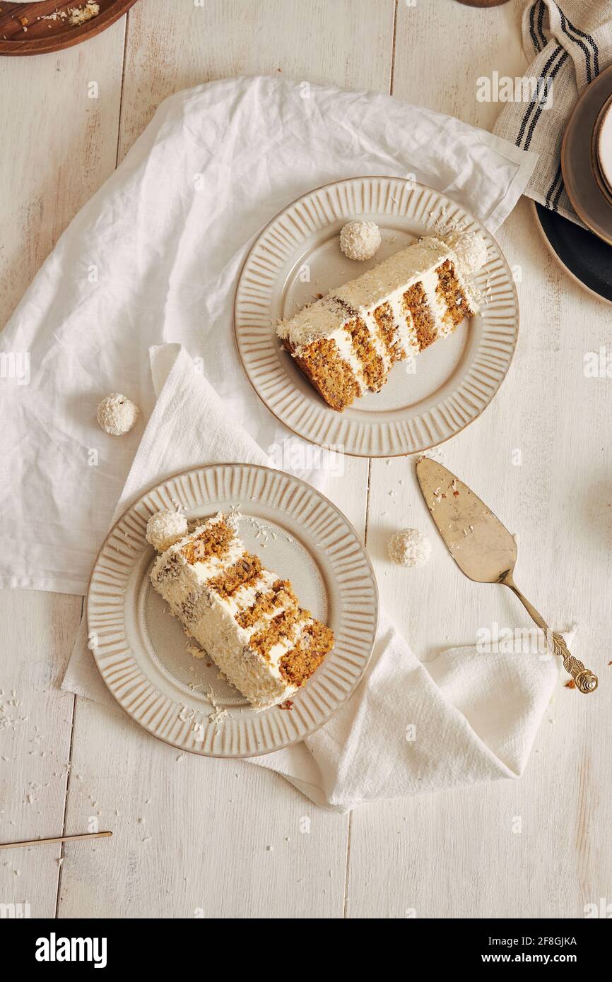 Top view of sliced white cakes on plates Stock Photo - Alamy