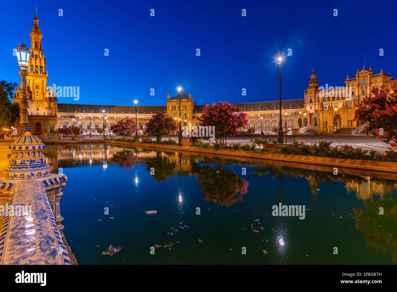 Plaza de Espana reflected on water during night, Sevilla, Spain Stock ...