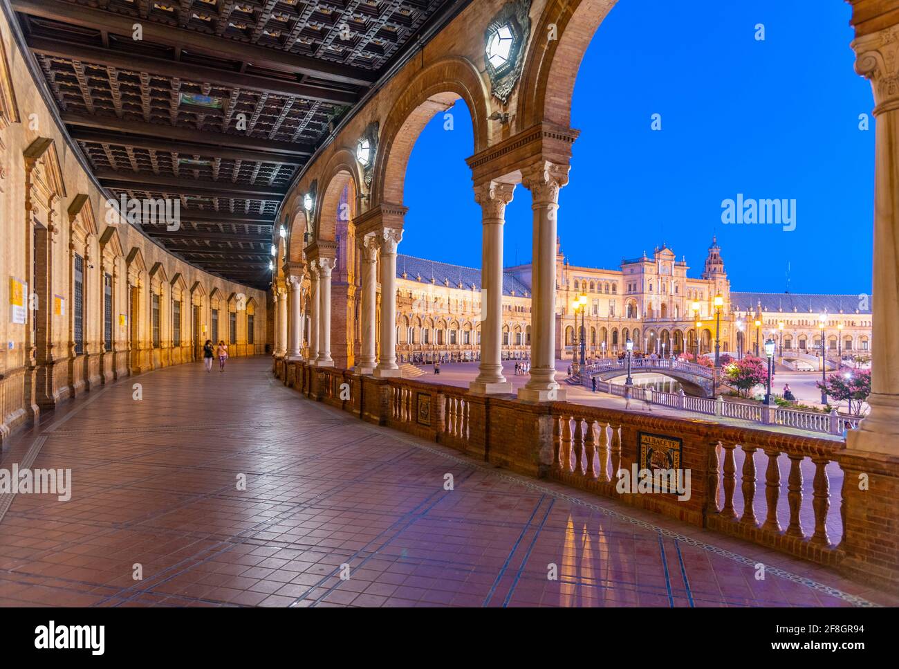 Night view of an arcade at Plaza de Espana in Sevilla, Spain Stock ...