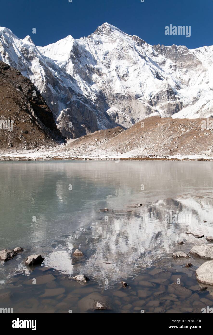 view of Cho Oyu mirroring in lake - Cho Oyu base camp - Everest trek ...