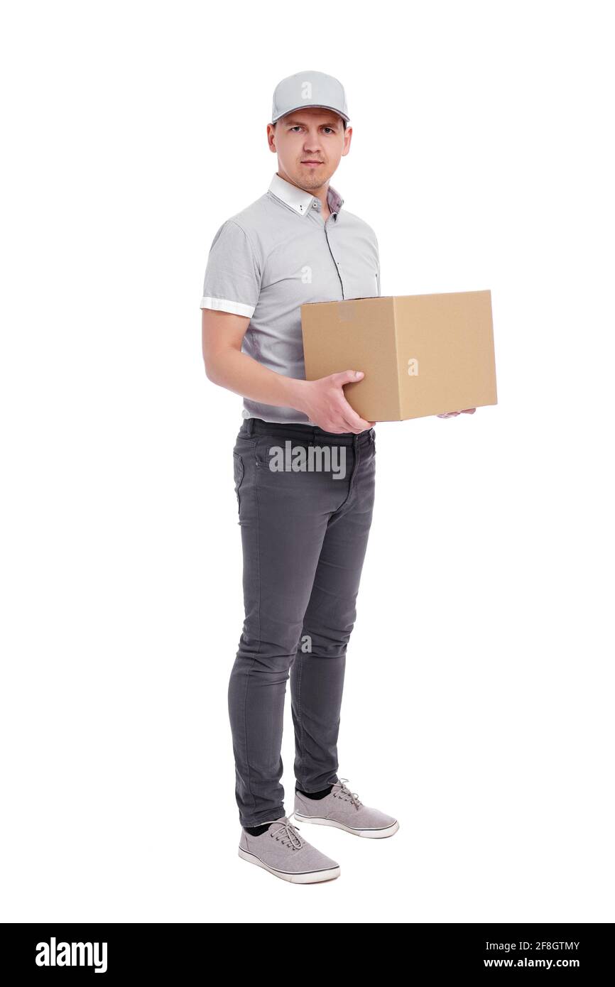 full length portrait of smiling postman or delivery man in uniform with ...