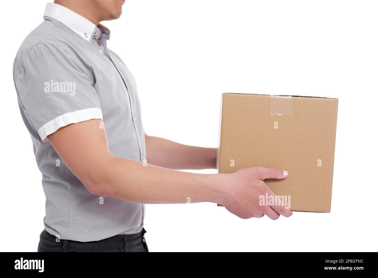 delivery concept - side view close up of a man giving box isolated on ...