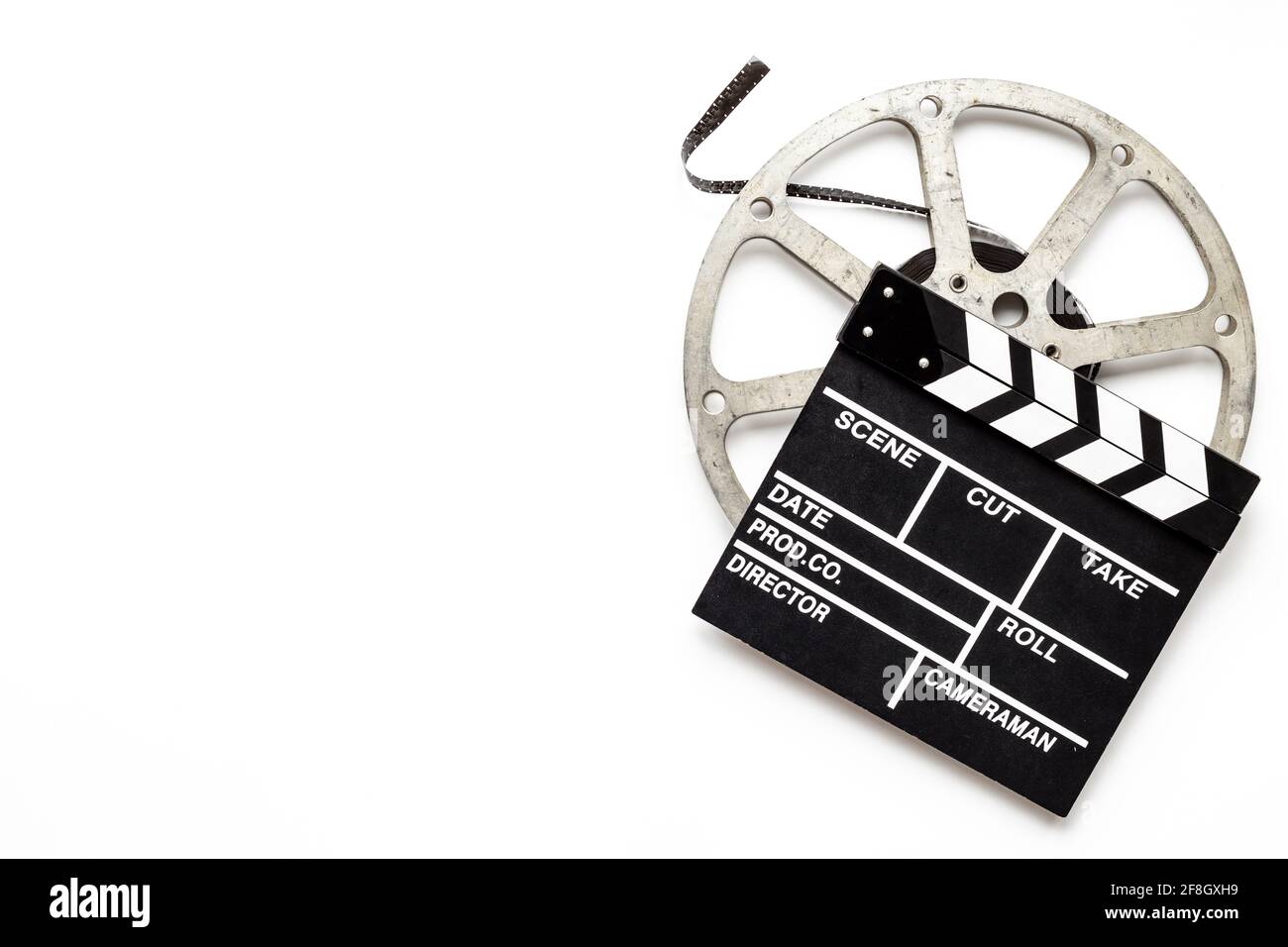 Movie clapper with film reel. Cinema background Stock Photo - Alamy