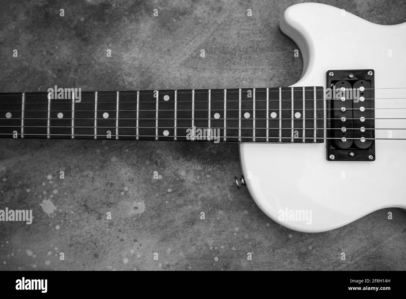 Beautiful vintage white electric guitar shape on a grey background in ...